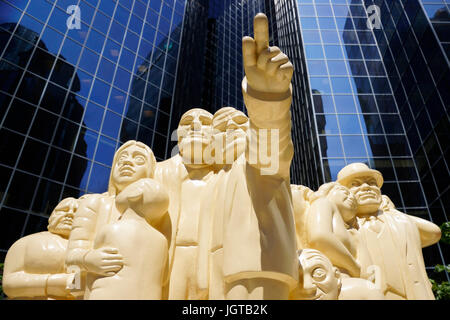 Illuminated Crowd Sculpture by Raymond Masson in front of a Stock Photo ...