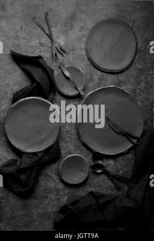 Empty black plate on grey stone table. Food background for menu ...