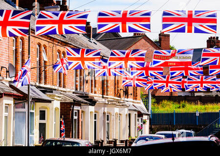 Terrace of unionist house decorated with Union Jack flags. Belfast ...
