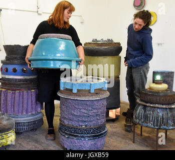 Student of ceramics and artist Sarah Bartmann (l) with installation ...