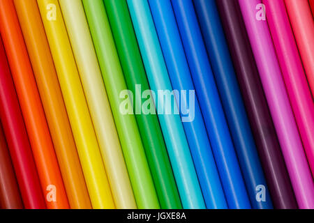 Color pencils for artistic drawing ordered by color gradient, on black ...