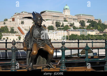 The statue of the Little Princess (Kiskirálylány) sitting on the railings of the Danube ...