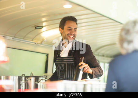 Hispanic man working at small business ecommerce holding packages ...