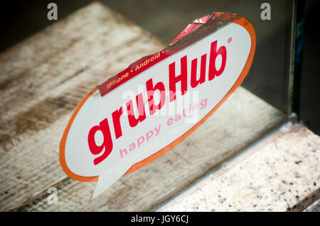 A worn sticker for the GrubHub internet food delivery service is seen ...