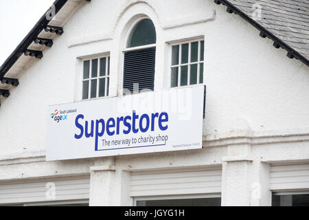 Age UK charity shop sign, Grove Shopping Centre, Witham, Essex Stock ...