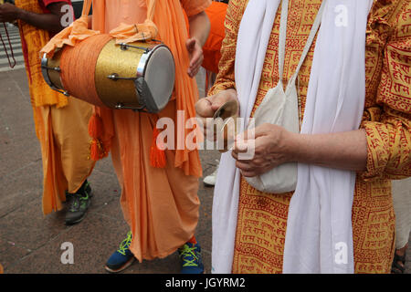 ISKCON devotees performing a harinam (devotional walk with dancing and ...