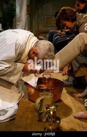 Priest at mass celebration in a catholic church. Close up on hand ...