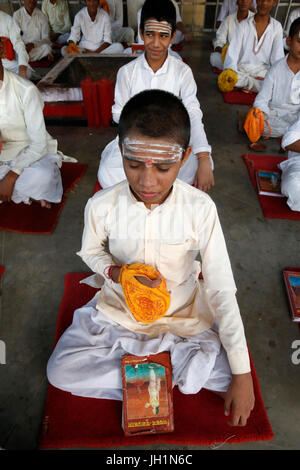 Brahmachari students practising meditation in a Vrindavan temple, Uttar ...