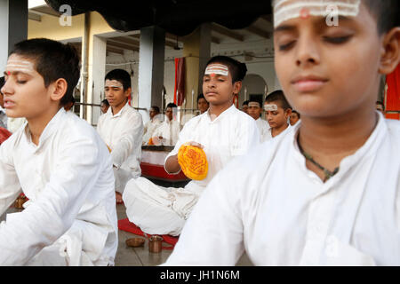 Brahmachari students practising meditation in a Vrindavan temple, Uttar ...