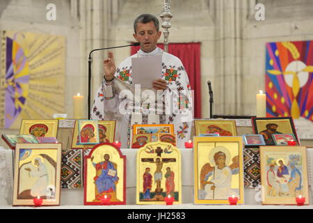 Melkite (Greek-catholic) priest blessing icons in Sainte Foy church ...