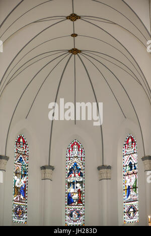 The interior of CHIJMES Hall, showing the arched ceiling and stained ...