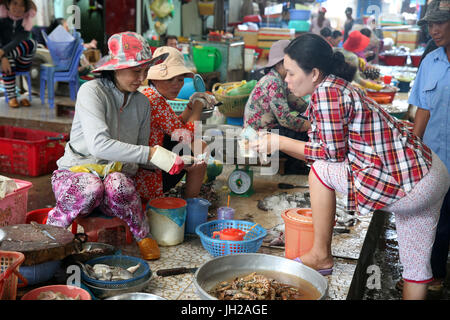 Vung Tau fish market. Woman sort through fresh catch of fish. Vietnam ...