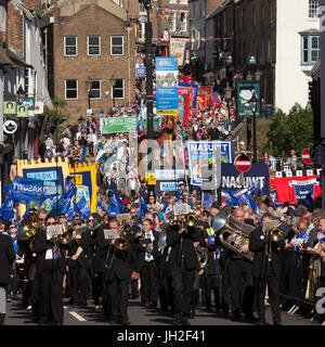 A marching band participates the parade of banners at the Durham Miners ...