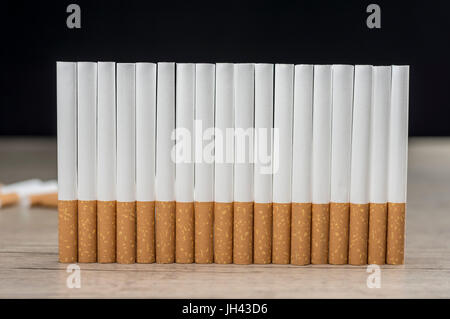 Close up shot of a raw of cigarettes background Stock Photo - Alamy