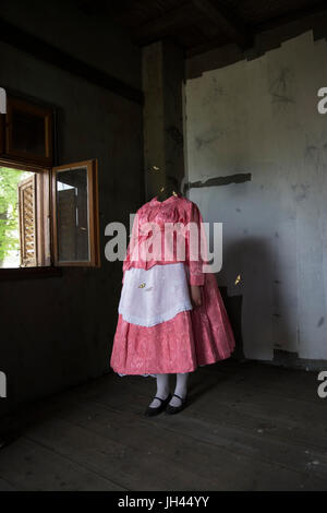 Mixed media artwork. Headless woman standing in the dark room, next to ...