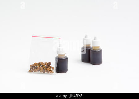 Propolis in the ziplock bags and solution of propolis. Selective focus ...