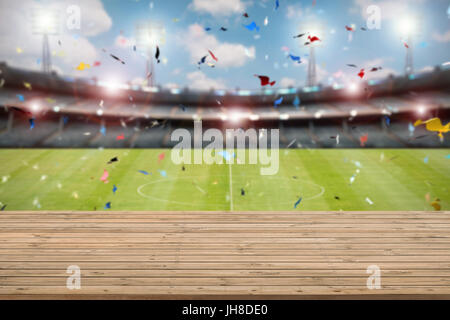 wooden counter with celebration in stadium background Stock Photo - Alamy