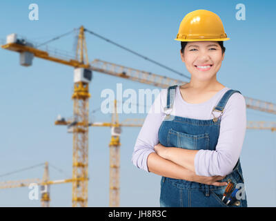 Construction supervisor wearing safety helmet and reflective vest ...