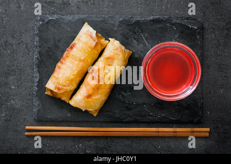 Vegetable spring rolls on black slate Stock Photo - Alamy