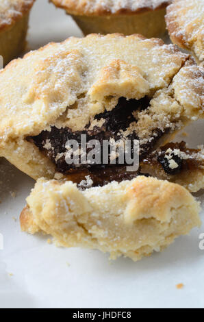 Close-up of a partially eaten pastry with visible puff pastry layers ...