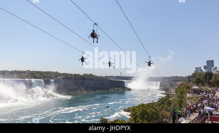 unrecognizable people taking zipline ride at Niagara Falls on Sep. 4 ...