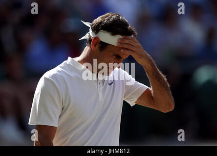 Roger Federer reacts during his match against Thomas Berdych on day ...
