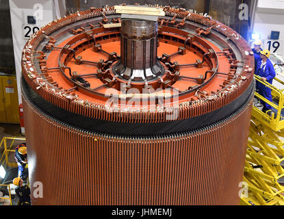 The generator rotor of an asynchronous motor generator is checked at ...