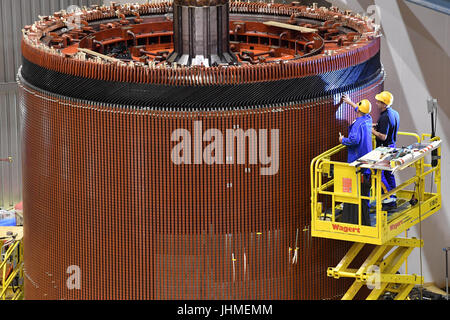 The generator rotor of an asynchronous motor generator is checked at ...