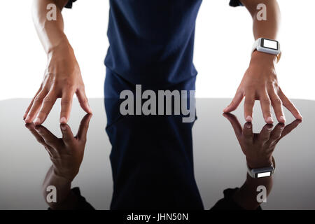 Mid section of businesswoman touching futuristic screen against copy ...