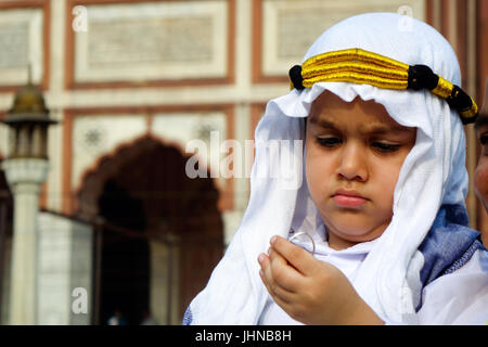 A adorable muslim child dressed well in arabian sheik costume or outfit ...