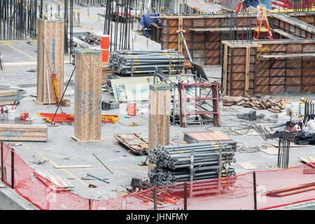 Building under construction with safety netting against falling debris ...