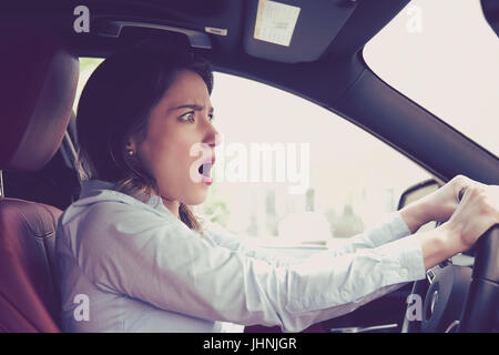 Woman driver scared shocked before crash or accident hands off wheel ...