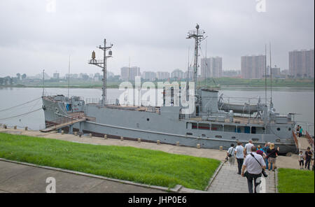 USS Pueblo moored on the Potong River, Pyongyang, as trophy following ...