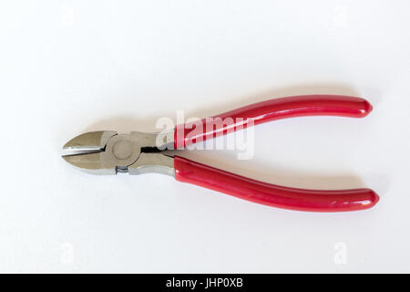 Red handle wire cutters on a white background Stock Photo - Alamy