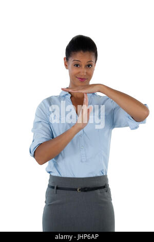 Businesswoman with pause hand gesture Stock Photo - Alamy