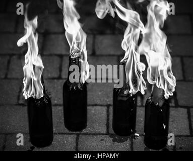 Molotov cocktails burning, multiple bottles Stock Photo - Alamy
