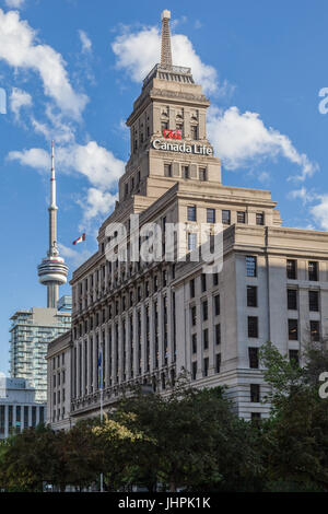 Upper part of Canada Life Building with CN tower in background Stock ...
