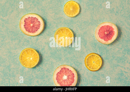Photograph of some grapefruit slices on light blue background Stock ...