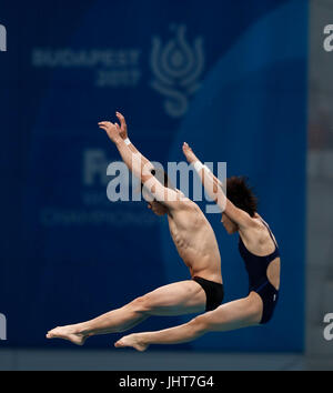 Kim Mi-rae and Hyon Il-Myong of North Korea pose on the podium during ...