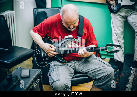 Behind the scene. Male guitarist artist musician practice playing ...