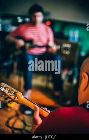 Behind the scene. Rock band practice in the messy recording music ...