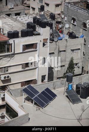 Rooftop solar panels are seen on the roof of a hospital, in Gaza City ...