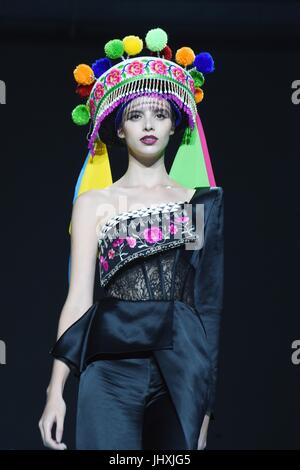 Chuxiong, China's Yunnan Province. 16th July, 2017. A woman of Yi ...