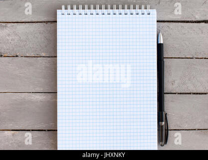 A notepad in a box for entries on a wooden table Stock Photo - Alamy
