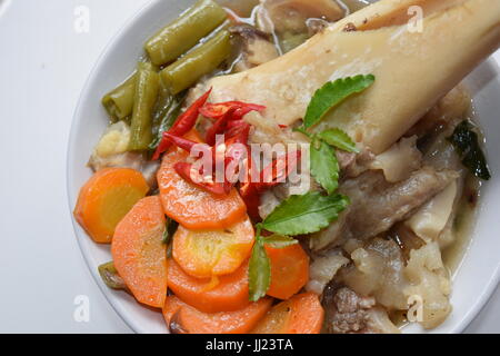 vegetable soup with beef leg Stock Photo - Alamy