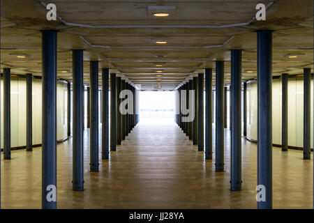 Underground pedestrian passage with alignments of metallic pillars ...