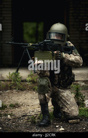 Strikeball player with submachine gun Stock Photo - Alamy