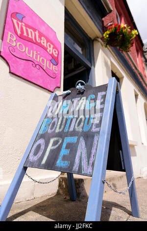 Sale sign notice into a clothes store. Shopping mall advertisement ...