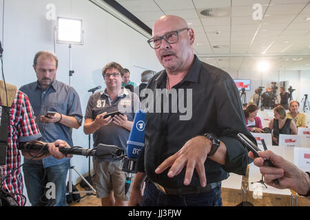 Alexander Probst, a representative of victims of abuse, talks to ...