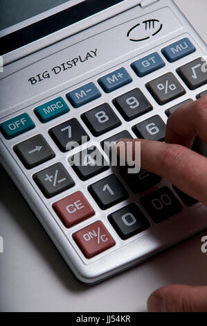 Gray calculator with red buttons and white background Stock Photo - Alamy
